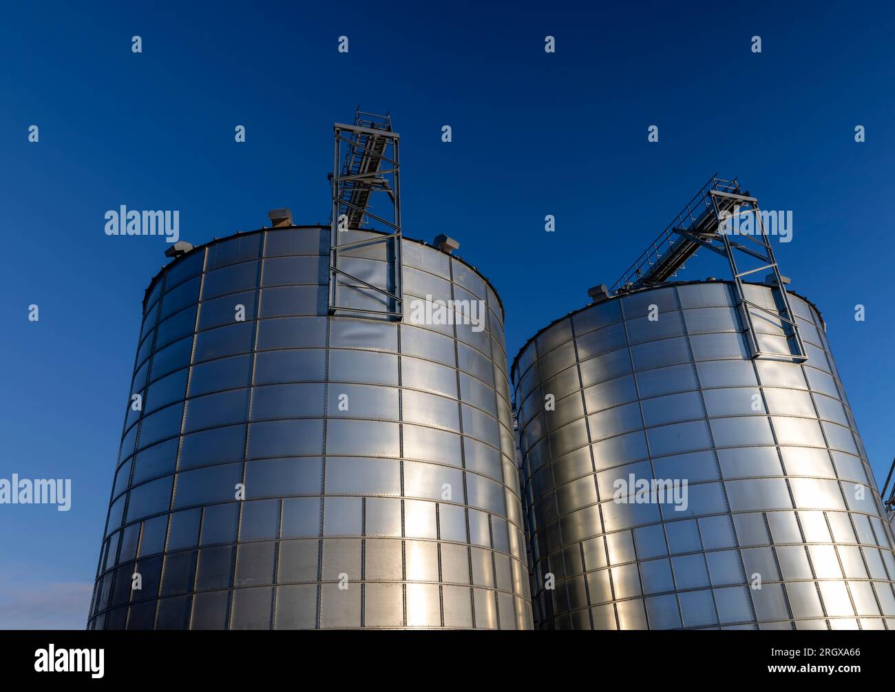 modern metal silo of large size, a silo at an agricultural enterprise ...