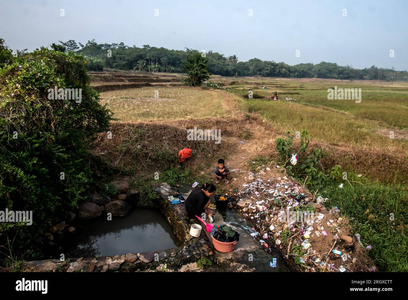Bogor, Indonesia. 12th Aug, 2023. Residents wash their clothes using ...