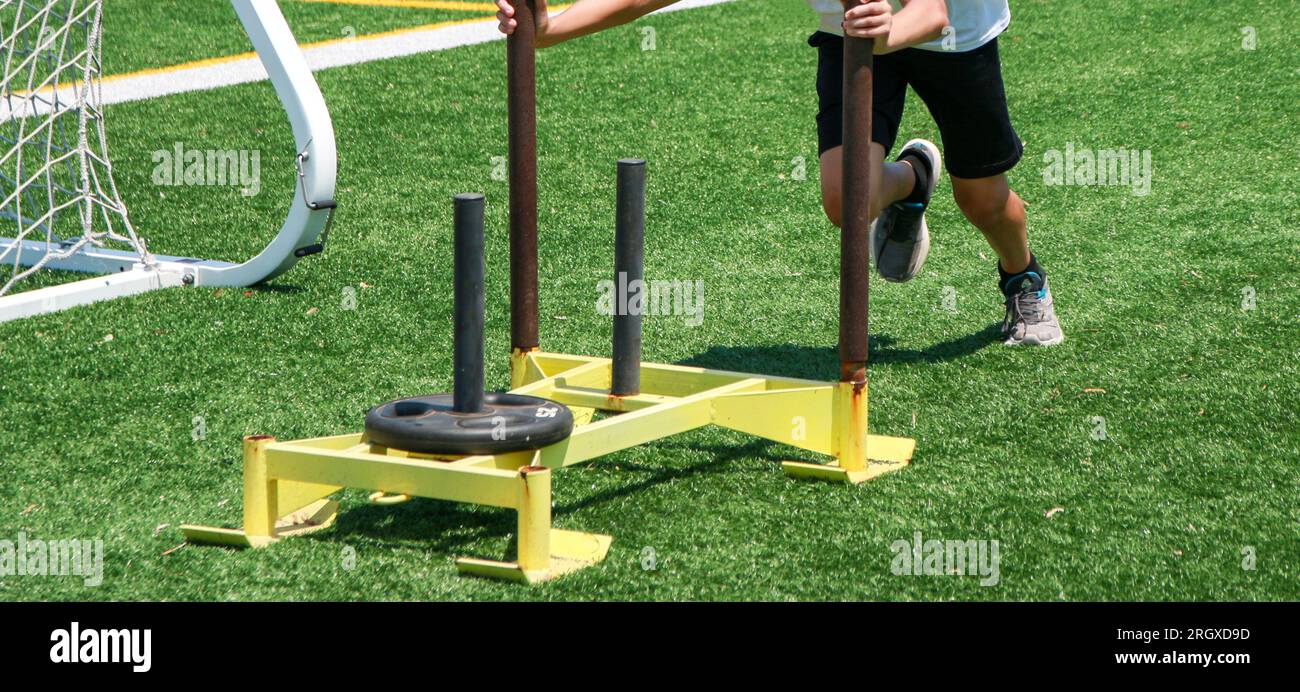 Boy pushing sled hi-res stock photography and images - Alamy
