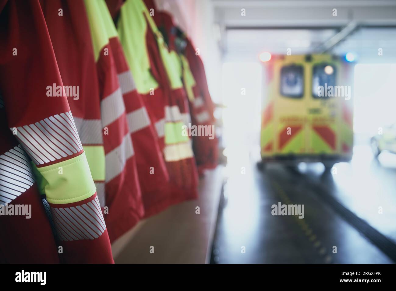 Close-up of paramedic uniforms and ambulance car of emergency medical ...