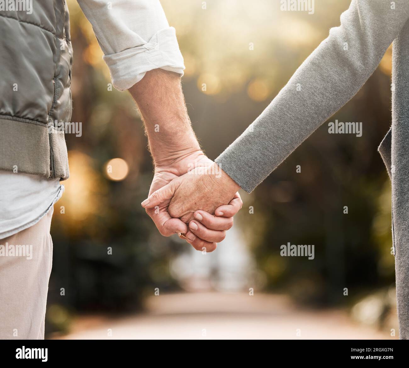 Love, park and relax couple holding hands, bonding and enjoy quality ...
