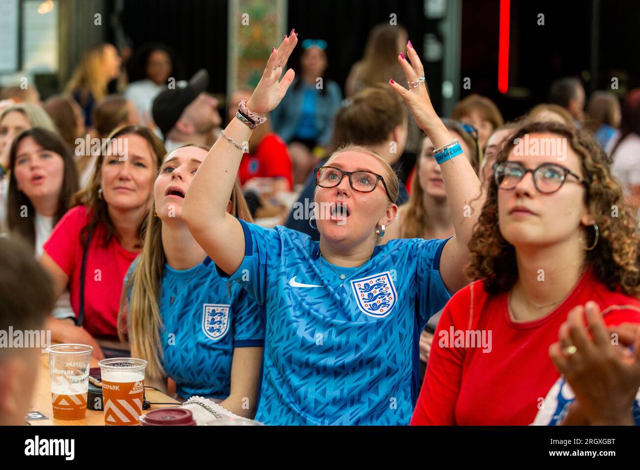 London, UK. 12 August 2023. England fans at BOXPARK in Shoreditch react ...