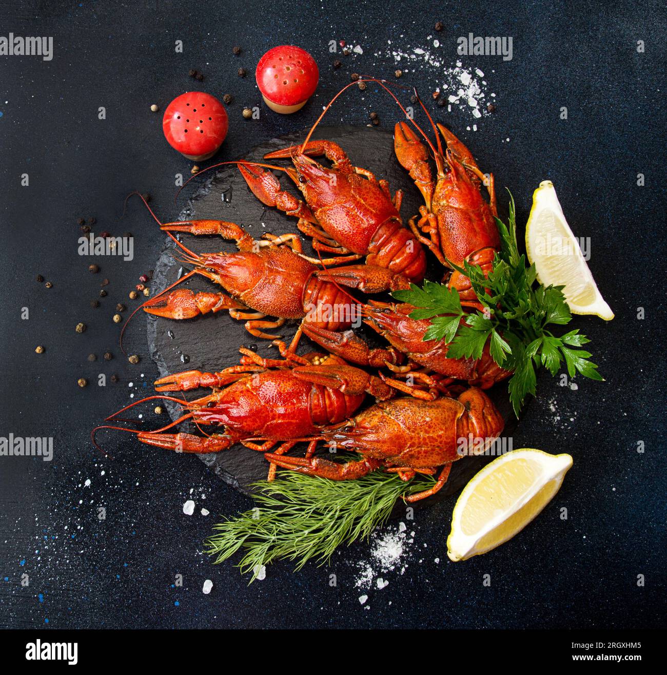 Boiled cooked crayfish crawfish ready to eat on white cutting board ...