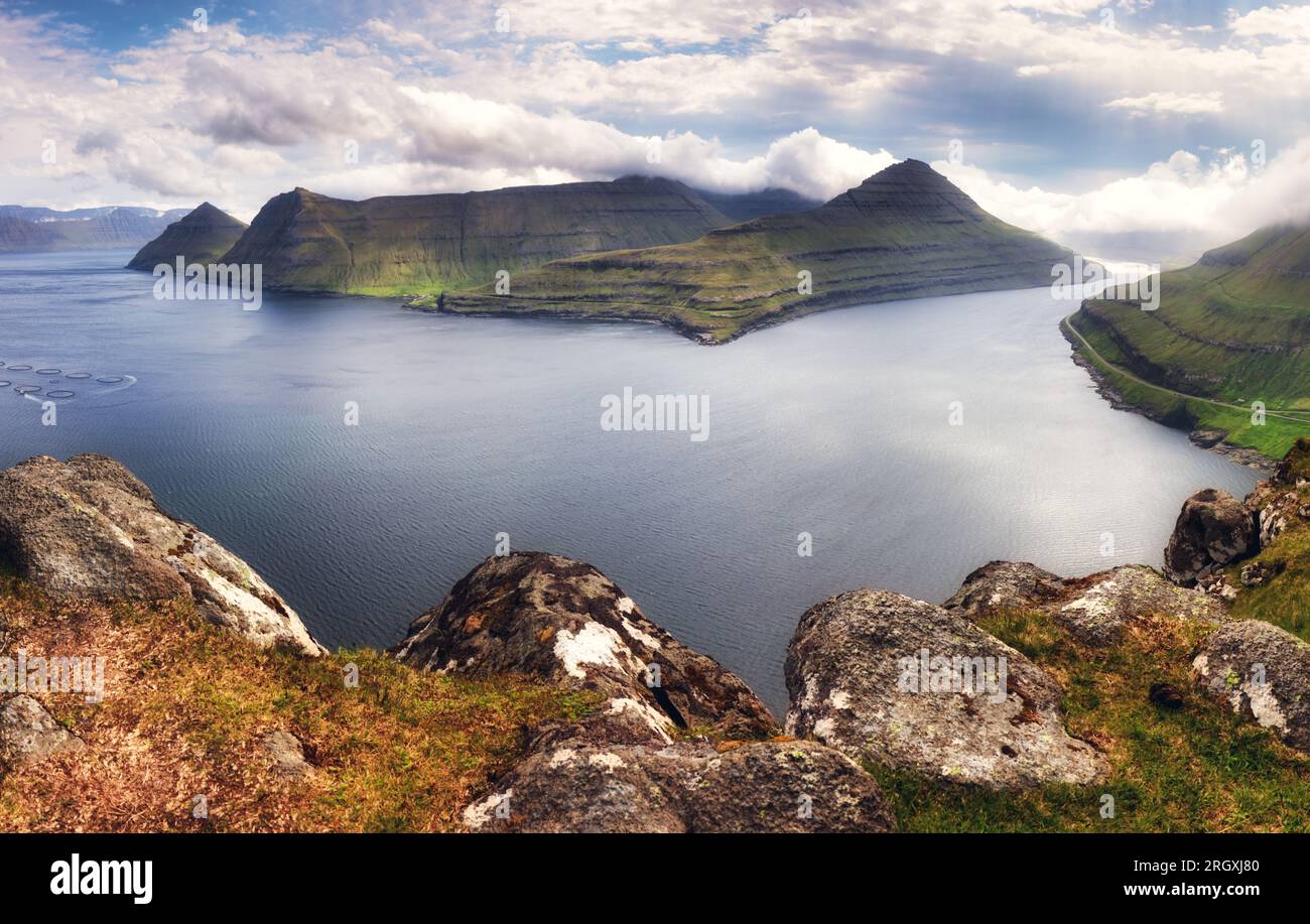 Mountain landscape panorama with ocean. Fog over the Funningur fjord on ...