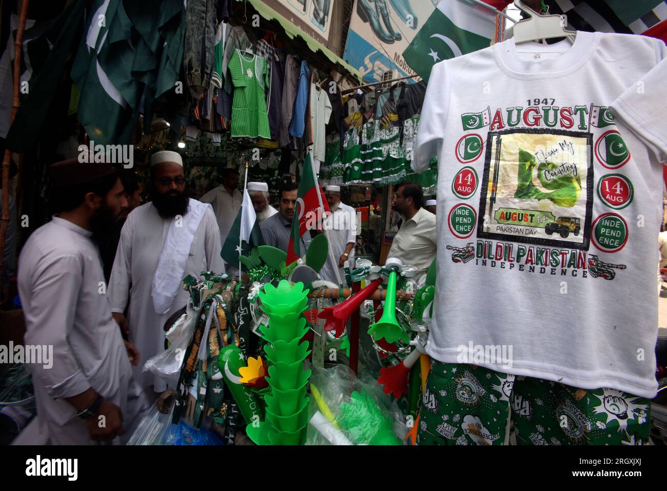 People visit a market to buy national flags, badges and masks ahead of ...
