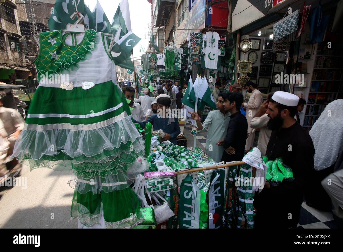 People visit a market to buy national flags, badges and masks ahead of ...