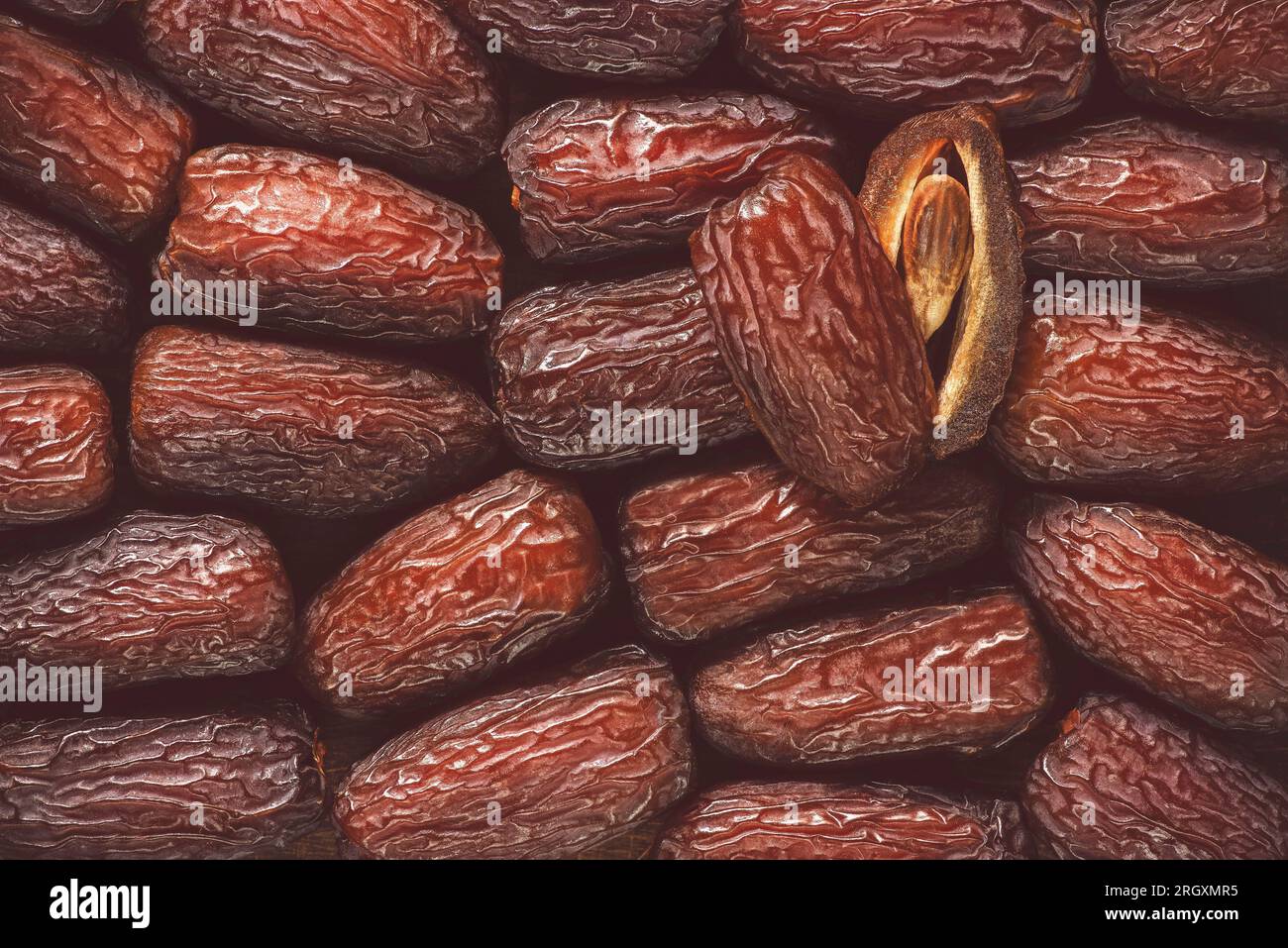 Close up for delicious organic Medjool dates. They have a sweet caramel ...