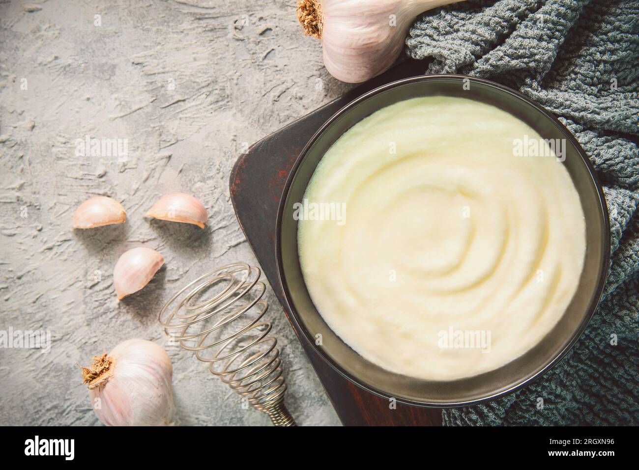 Arabic Cuisine; Traditional Lebanese garlic dip "Toum or Toumya". It is ...