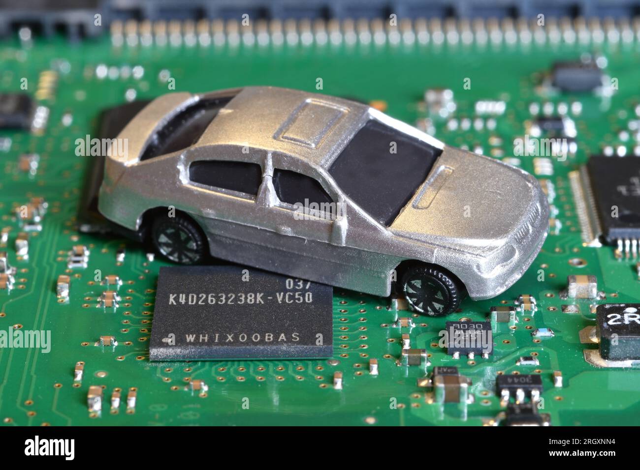 Toy cars on electronic board and microchip. Conceptual image for ...