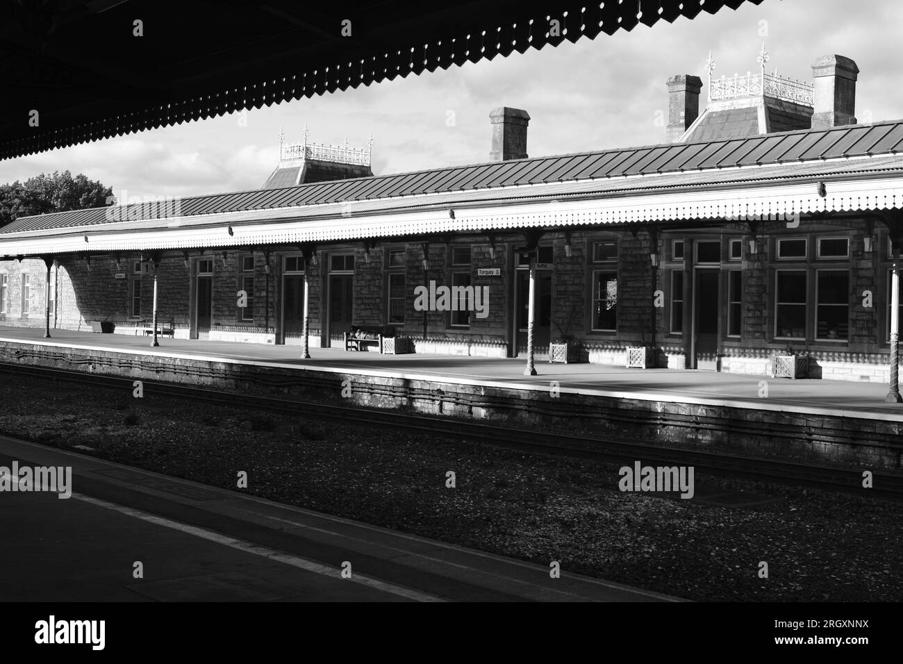Black and white image of Dawlish train station with the line running ...