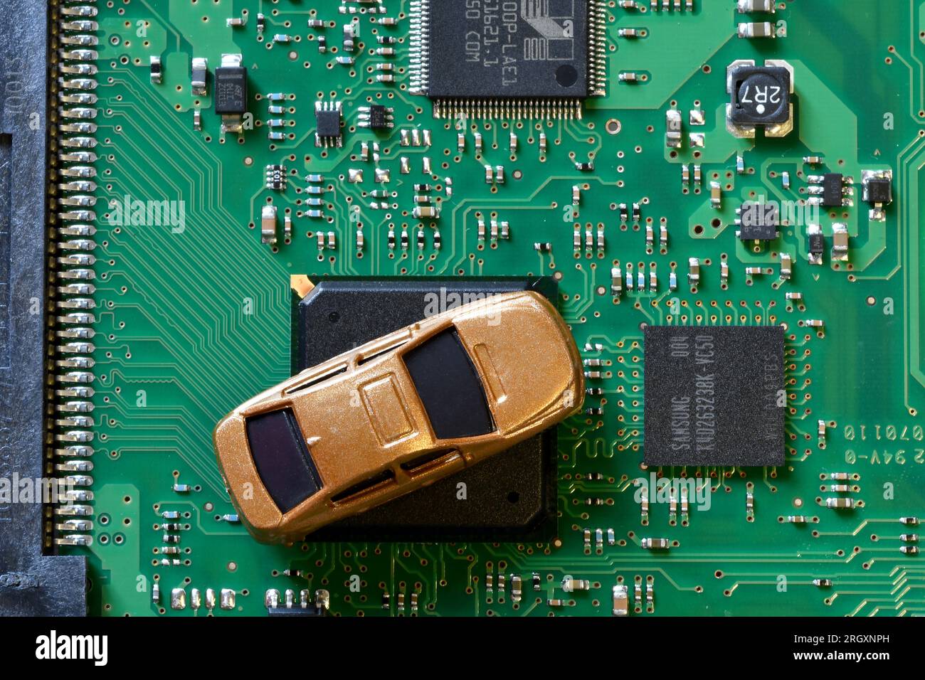 Toy cars on electronic board and microchip. Conceptual image for ...