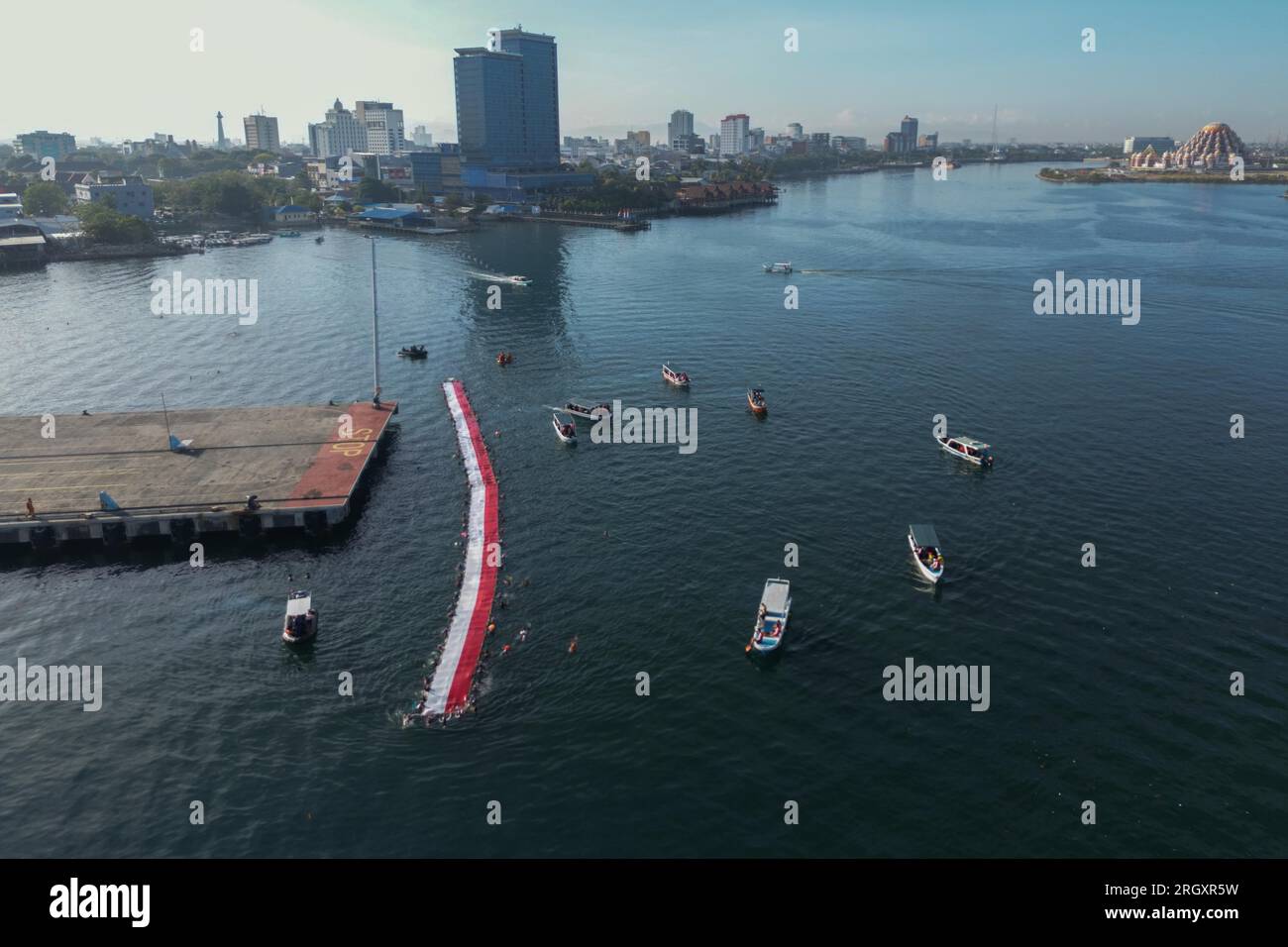 Makassar, South Sulawesi, Indonesia. 12th Aug, 2023. Aerial photo of a number of swimmers ...