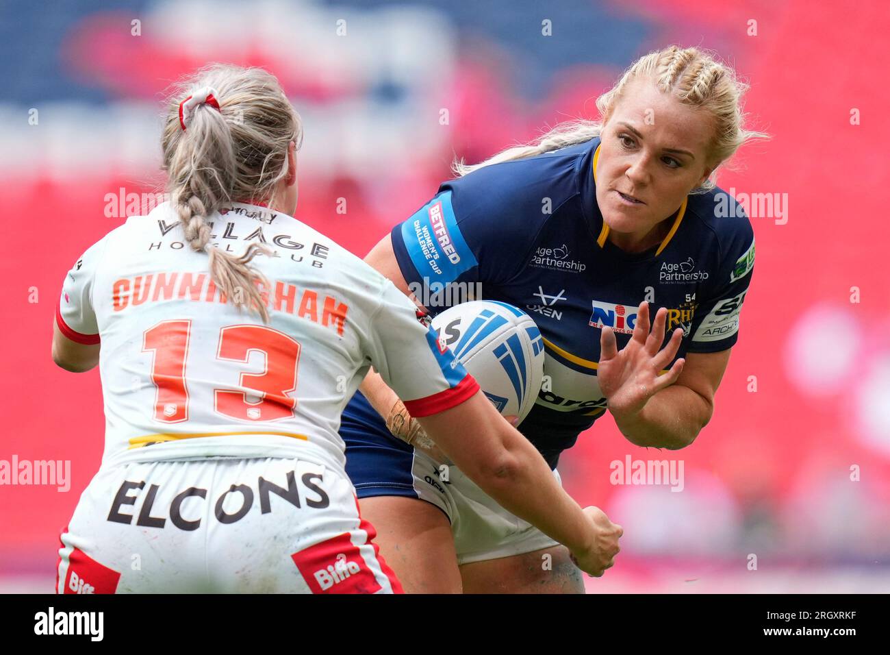 Amy Hardcastle #11 of Leeds Rhinos runs at Jodie Cunningham #13 of St ...