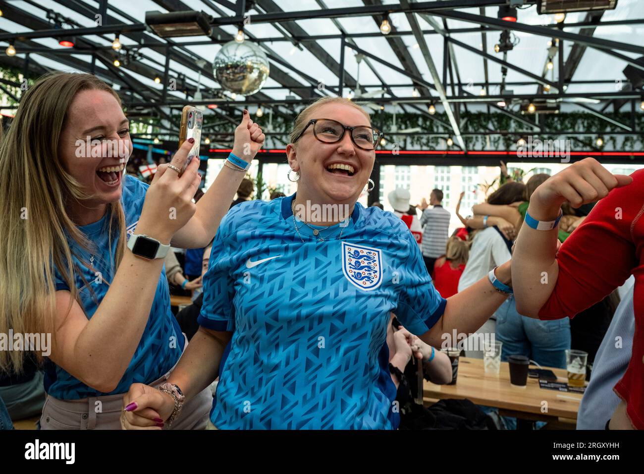 London, UK. 12 August 2023. England fans at BOXPARK in Shoreditch ...