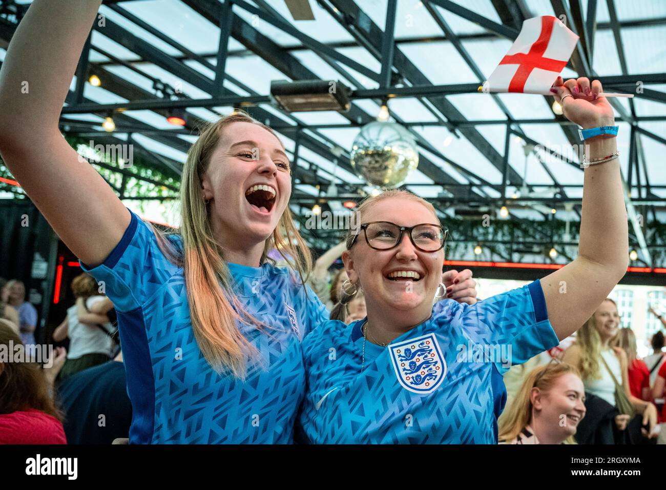 London, UK. 12 August 2023. England fans at BOXPARK in Shoreditch ...