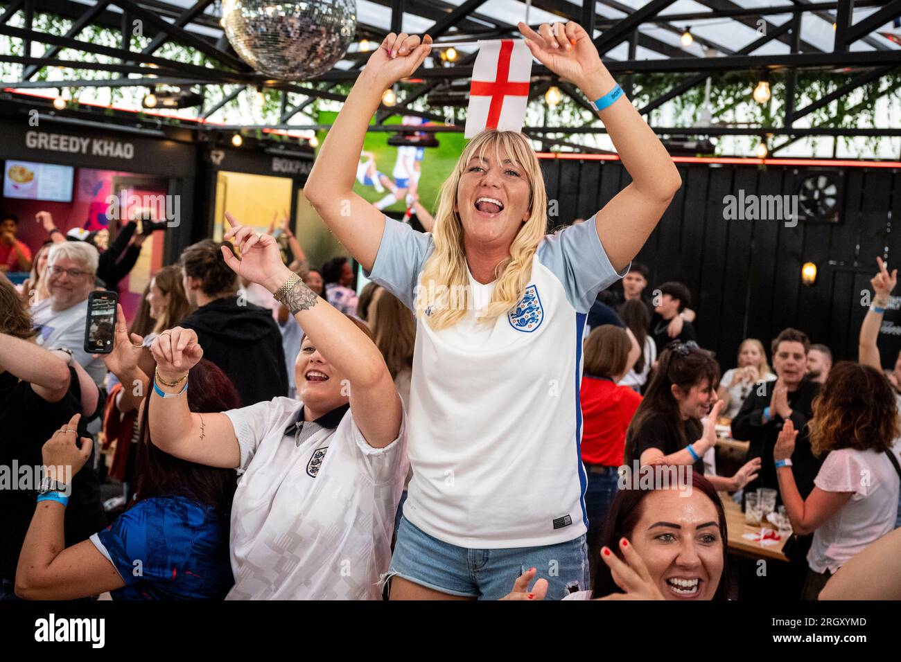 London, UK. 12 August 2023. England fans at BOXPARK in Shoreditch ...
