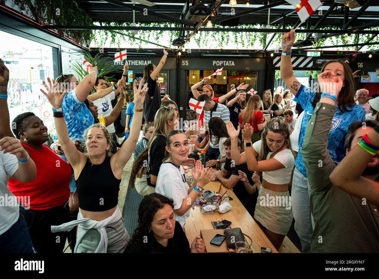 London, UK. 12 August 2023. England fans at BOXPARK in Shoreditch ...