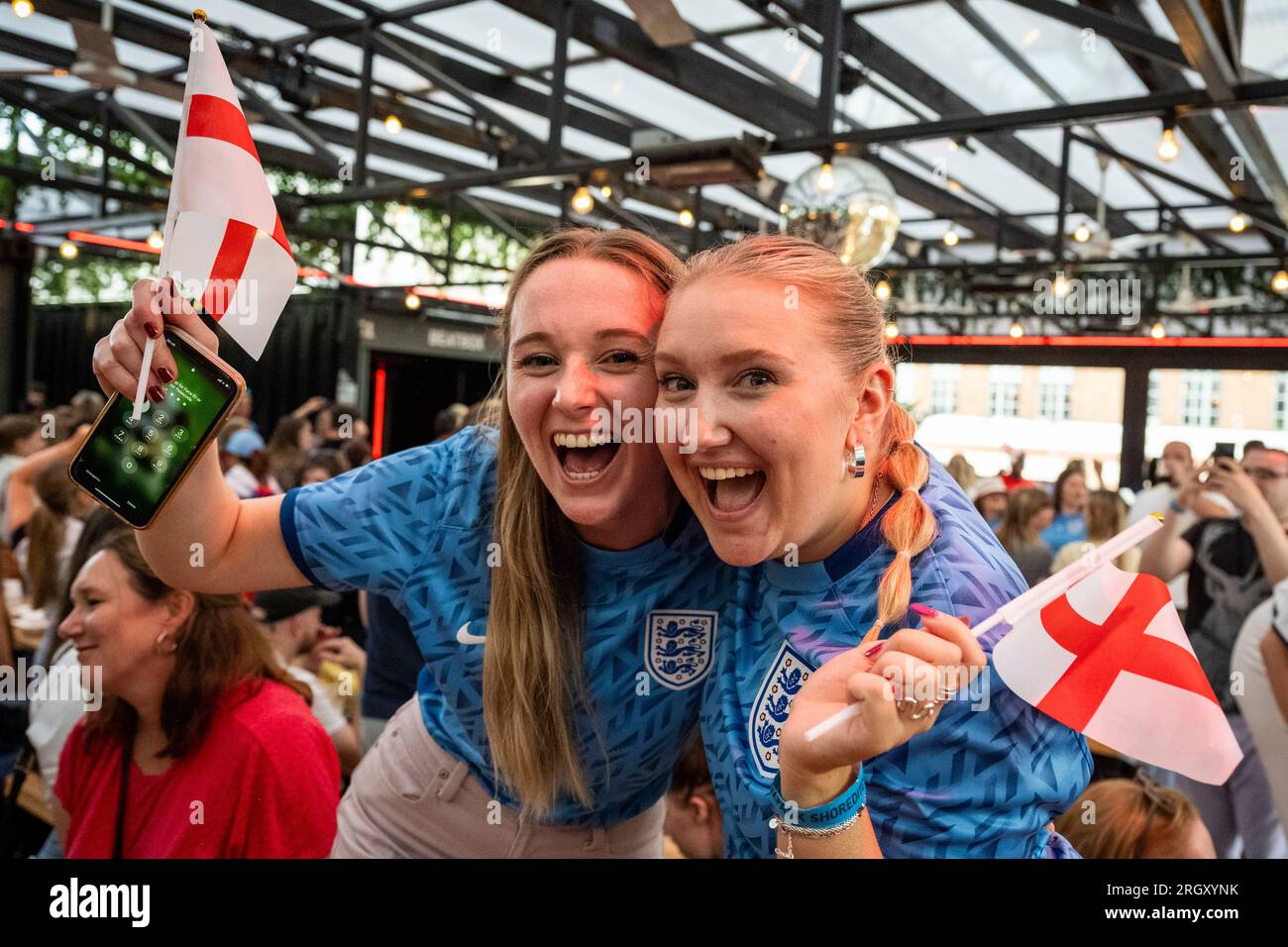 London, UK. 12 August 2023. England fans at BOXPARK in Shoreditch ...