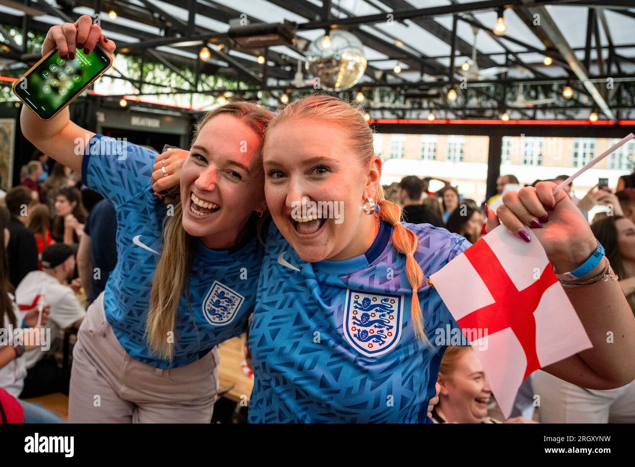 London, UK. 12 August 2023. England fans at BOXPARK in Shoreditch ...