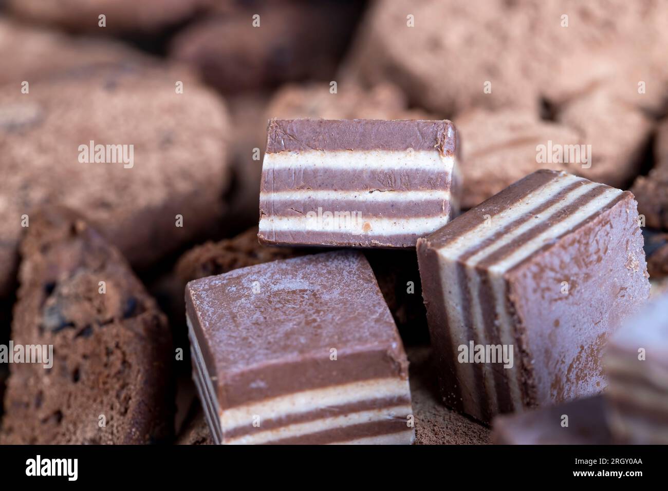 multi-layered sweets made of cream and chocolate layers with different ...