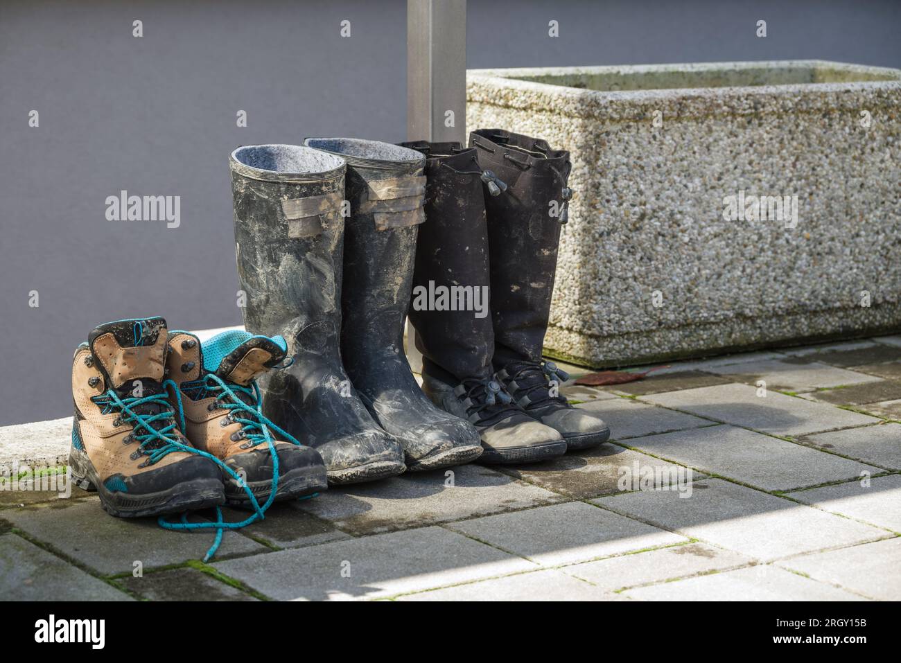 Muddy boots after floods in the city streets after heavy rain. Severe ...