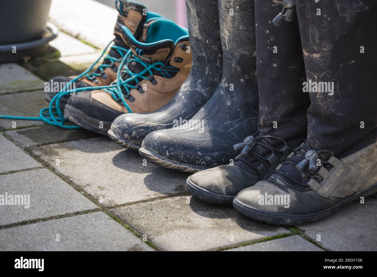 Muddy boots after floods in the city streets after heavy rain. Severe ...