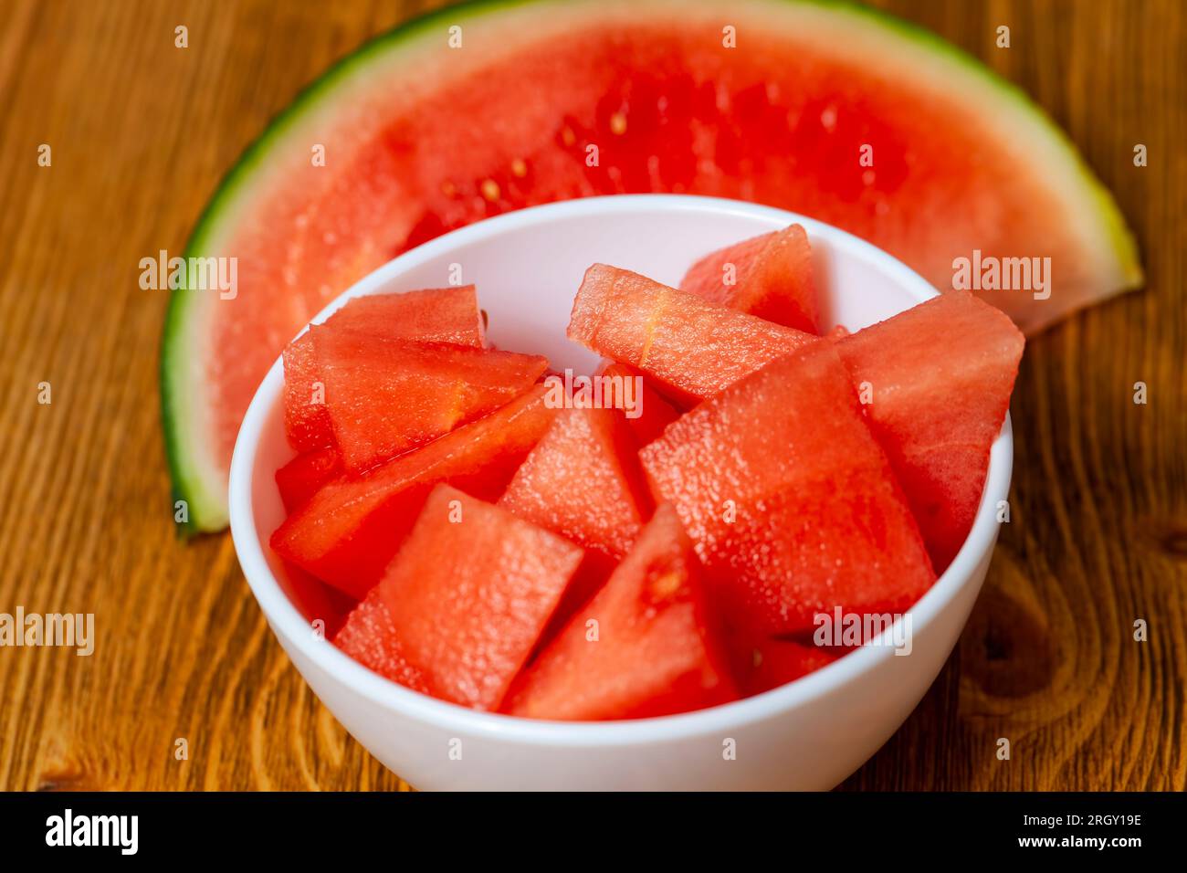red ripe watermelon divided into pieces and slices watermelon on a ...