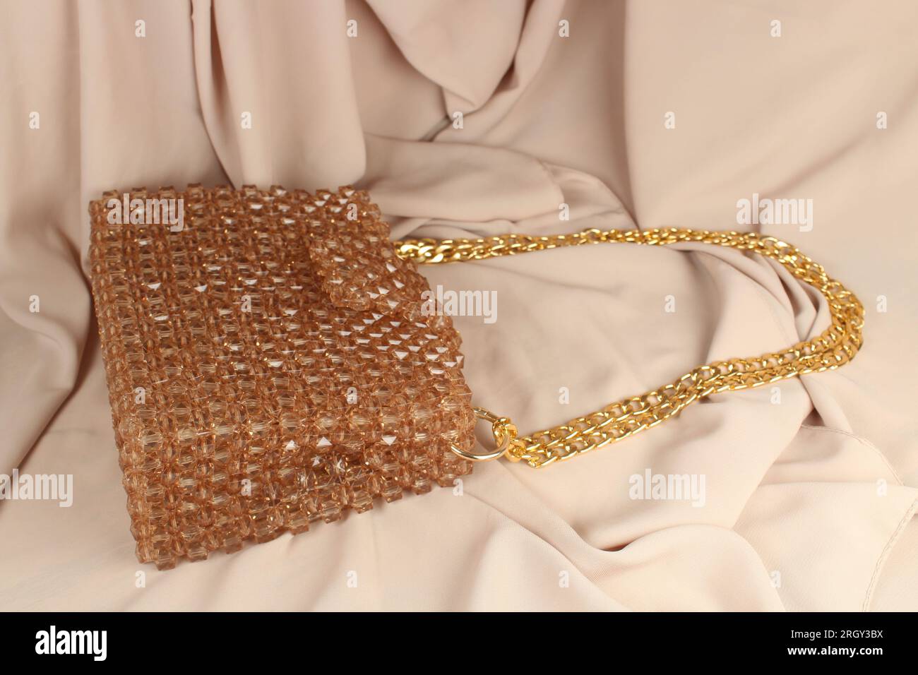 Handmade mink bead bag on cream fabric Stock Photo - Alamy
