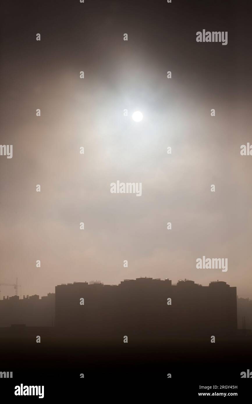 multi-storey buildings in the city in thick fog in the morning, a multi ...