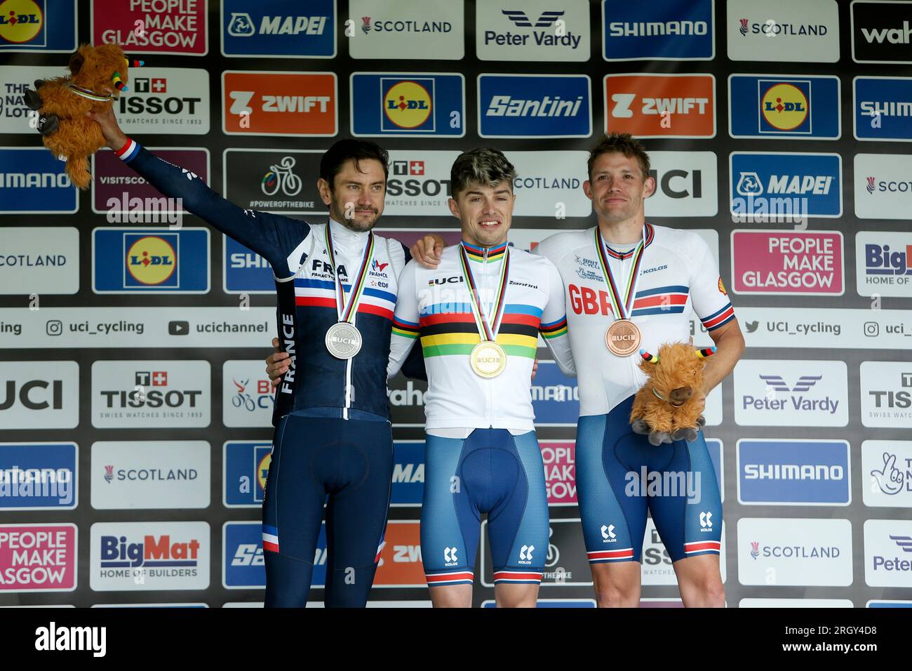 Great Britain's Finlay Graham (centre) poses with his medal after ...
