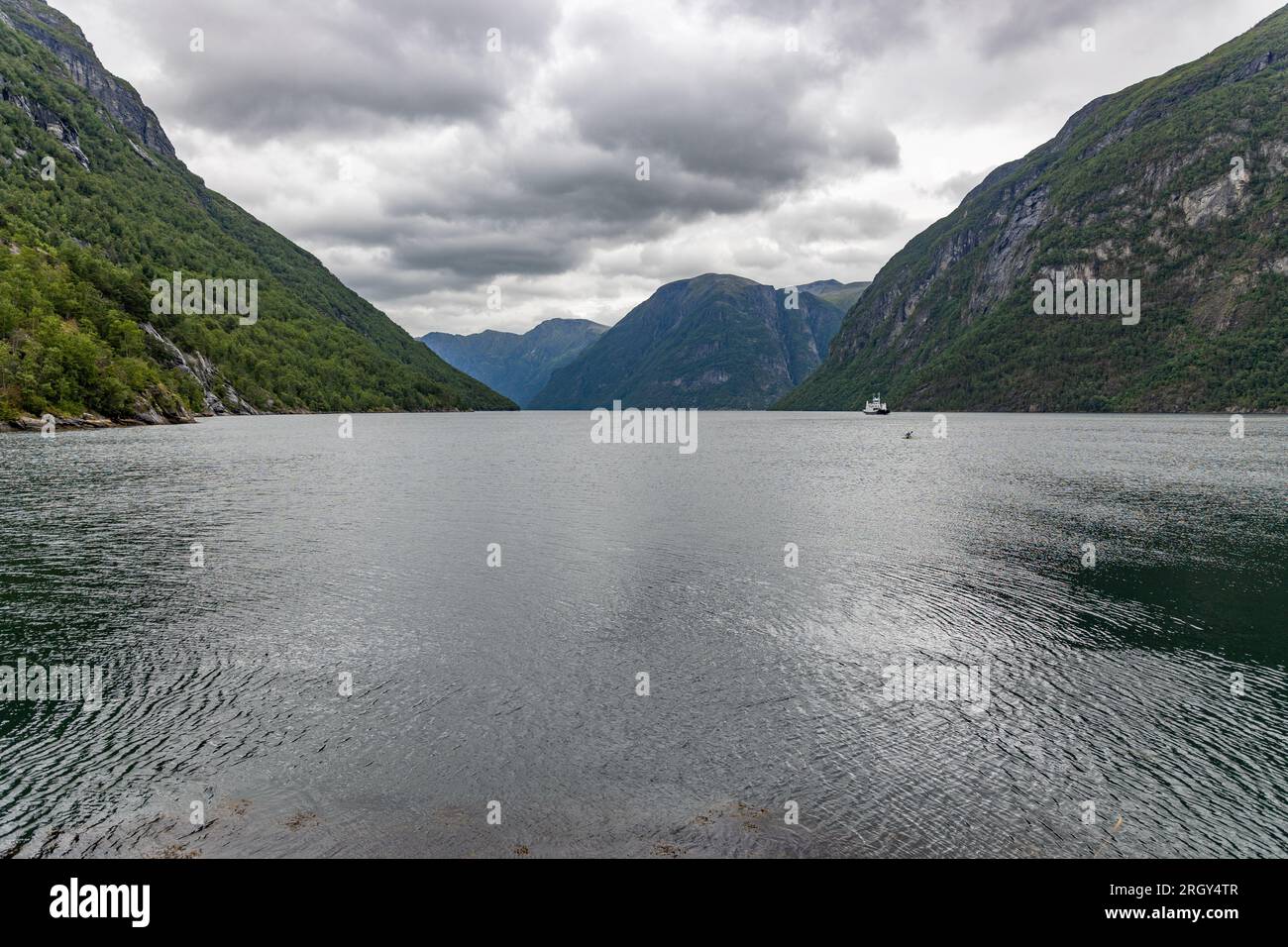 The Hellesylt fjord in Norway, surrounded by high mountains, Although ...