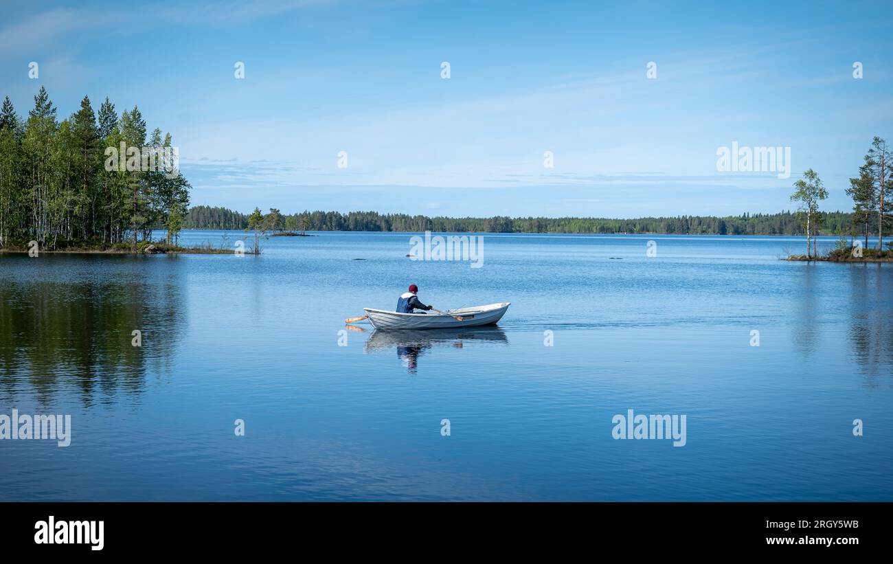 Man in a row boat hi-res stock photography and images - Alamy