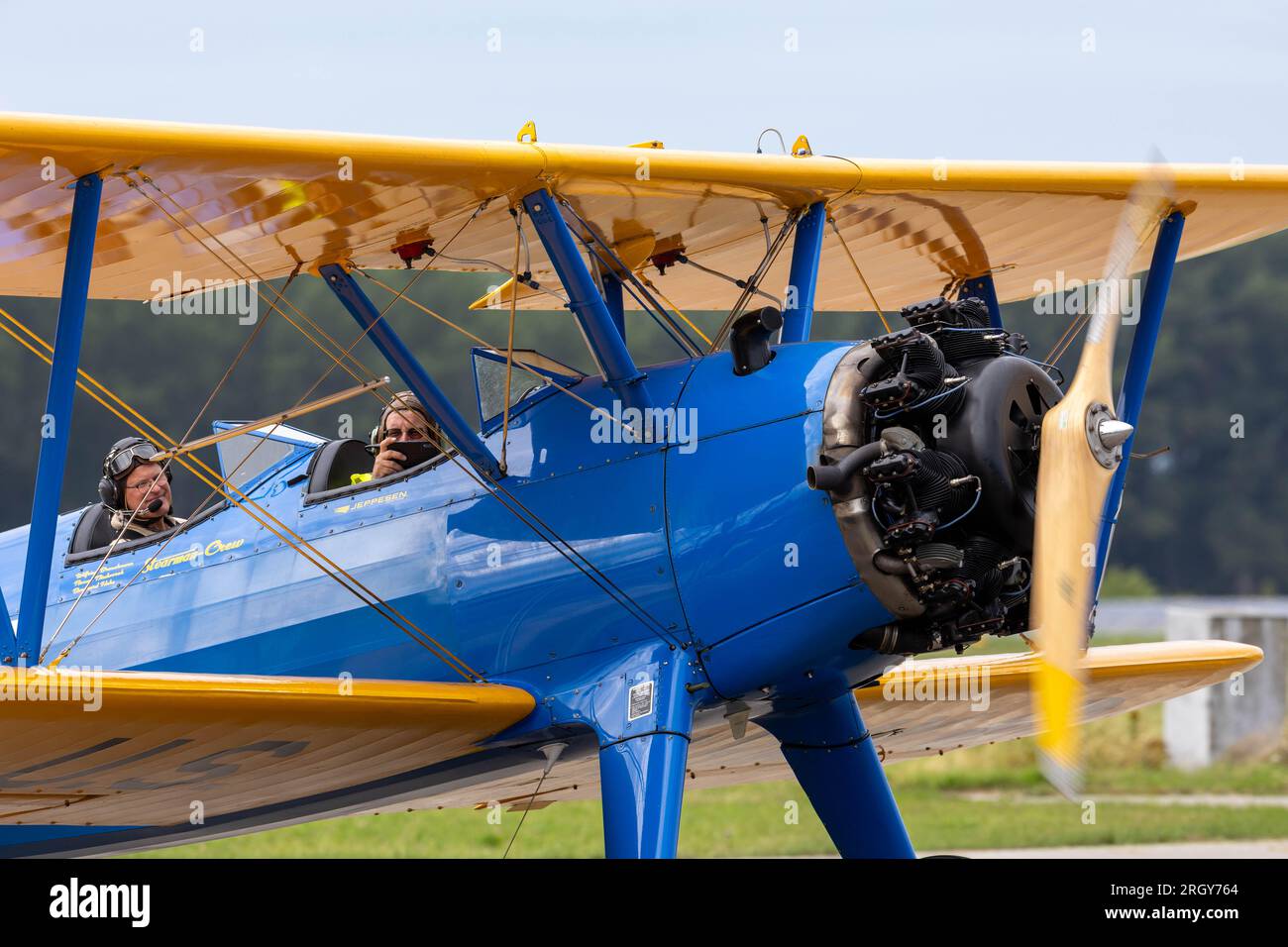 Bautzen, Germany. 12th Aug, 2023. A biplane drives off the runway ...