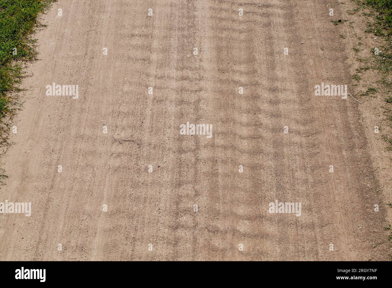 features on paved sandy road in rural area, road for traffic in rural ...