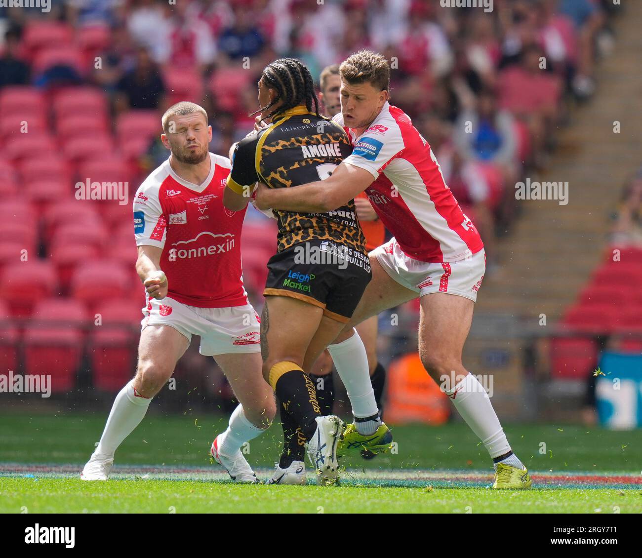 Tom Amone #8 of Leigh Leopards runs at Rhys Kennedy #15 of Hull KR ...