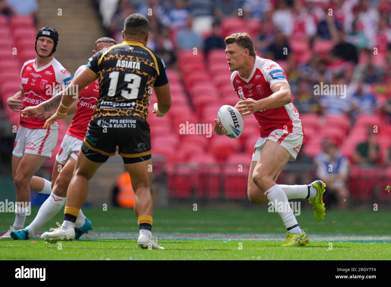 Rhys Kennedy #15 of Hull KR runs at the Leigh Leopards defence during ...