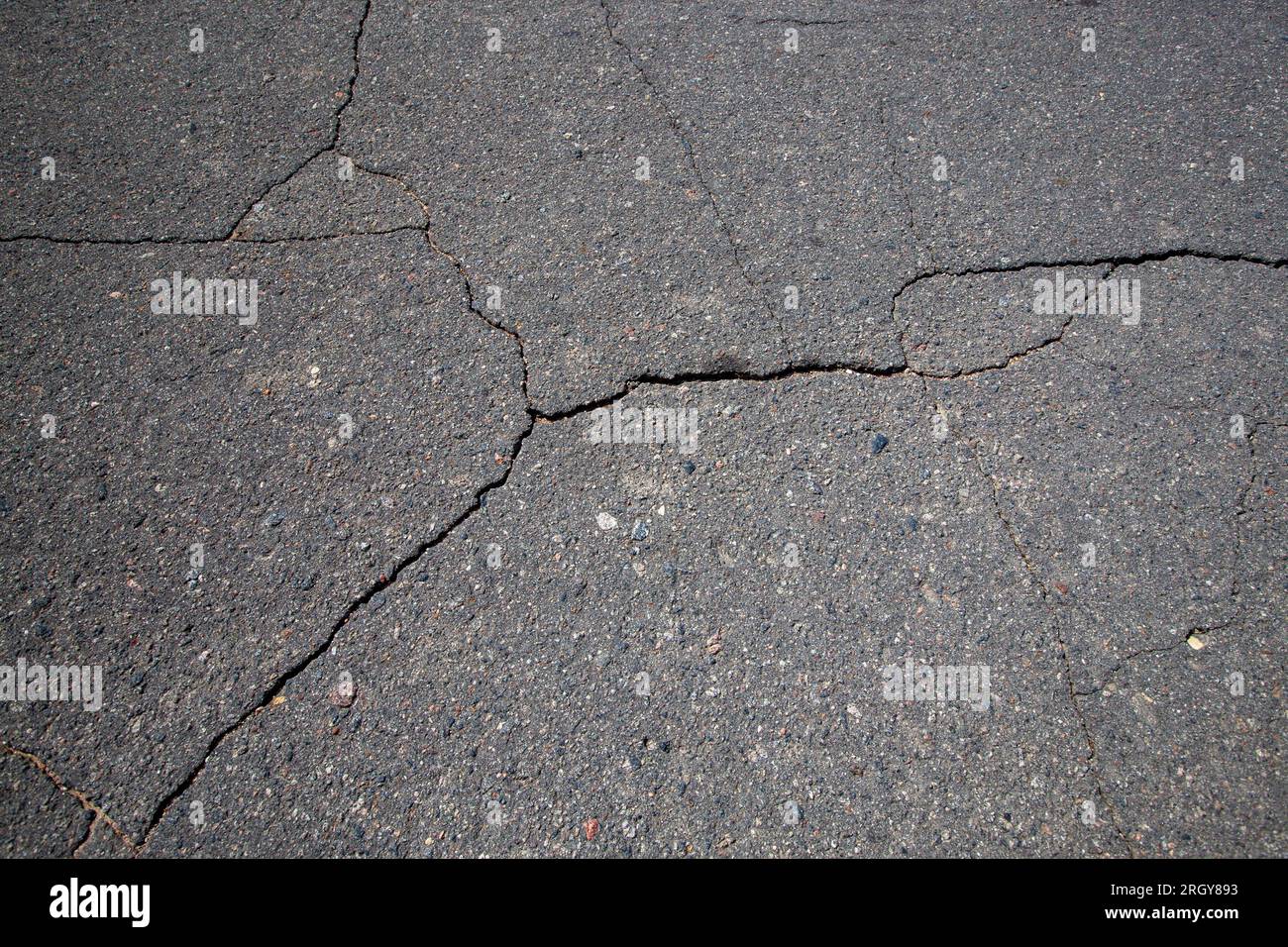 cracks on the paved highway, poor quality of the asphalt pavement of ...