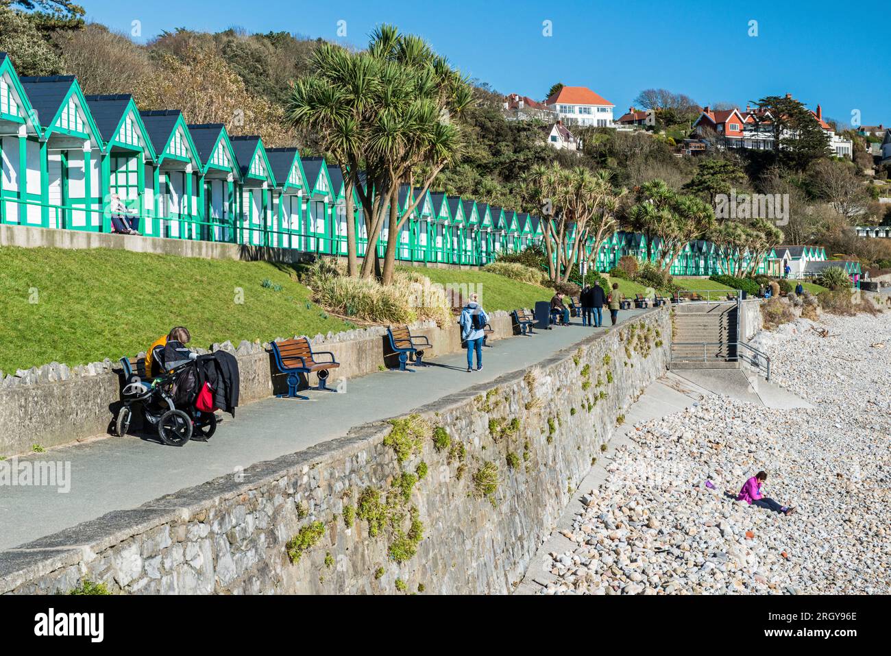 Seafront and Beach Huts at Langland Bay on the Gower Peninsula on a ...