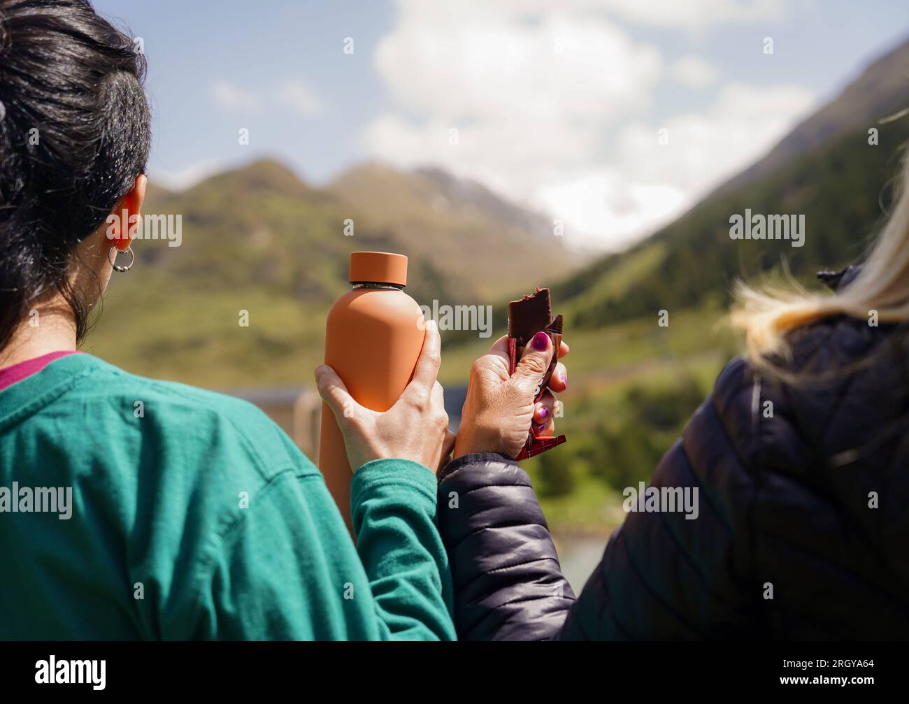trekking with a snack and water with mountains landscape. break for eat ...