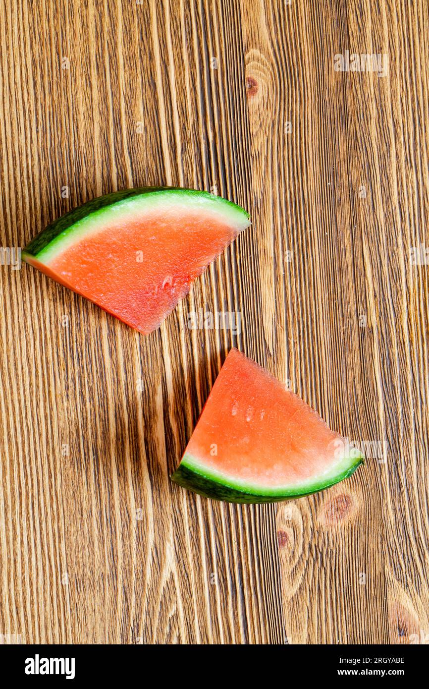 red ripe watermelon divided into pieces and slices watermelon on a ...
