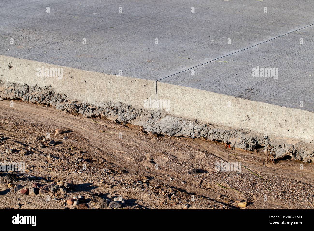 a thick layer of a new road made and built of concrete slabs, the construction of a new concrete ...