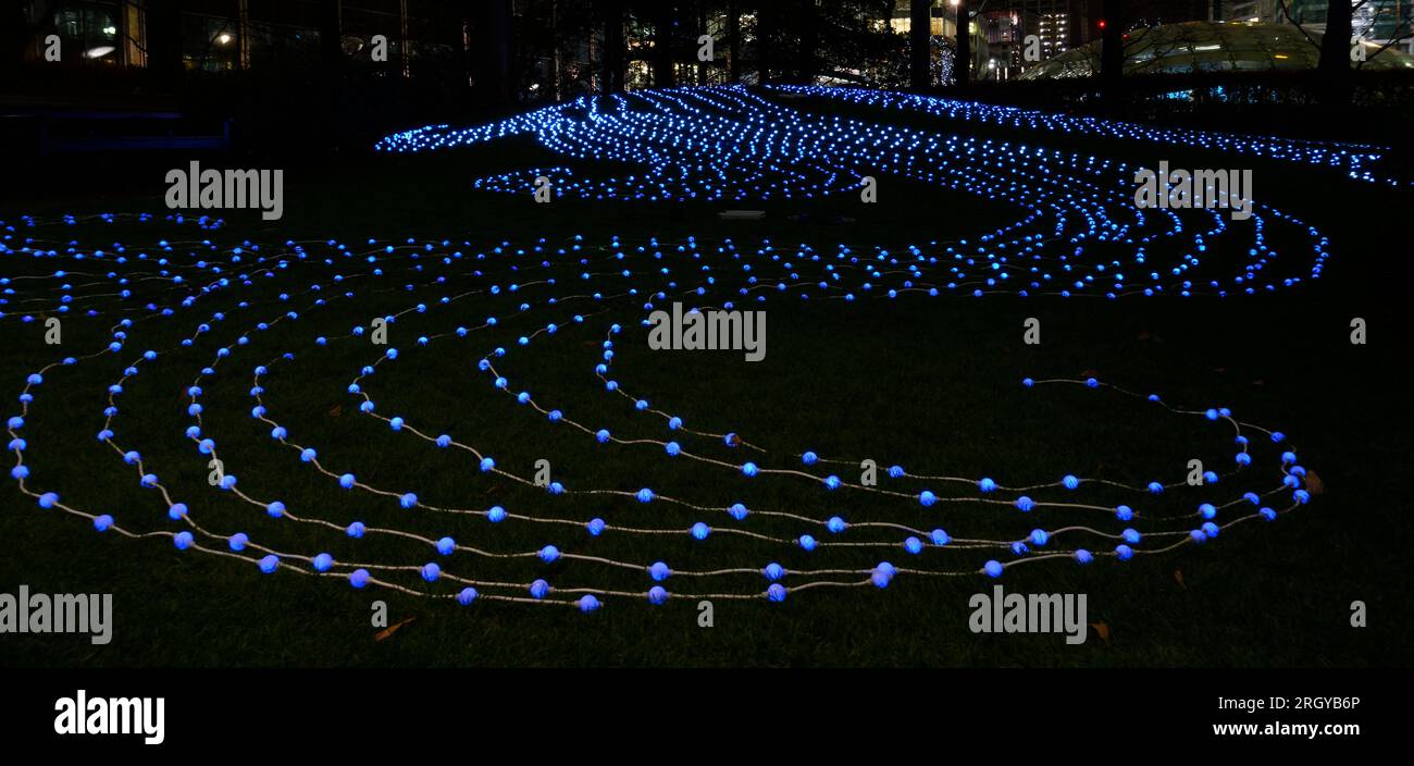 A carpet of lights in the shape of a wave - Canary Wharf Winter Lights ...