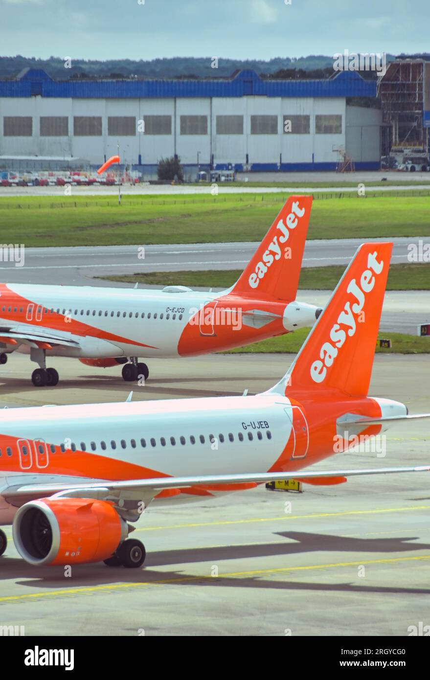 London, England, UK - 1 August 2023: Tail fins of Airbus A320 passenger ...