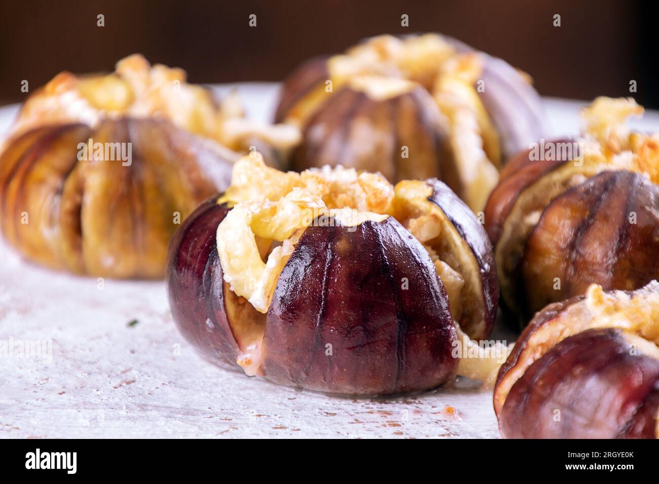 Ripe figs baked with cow's-milk cheese brie and camambert and sprinkled ...