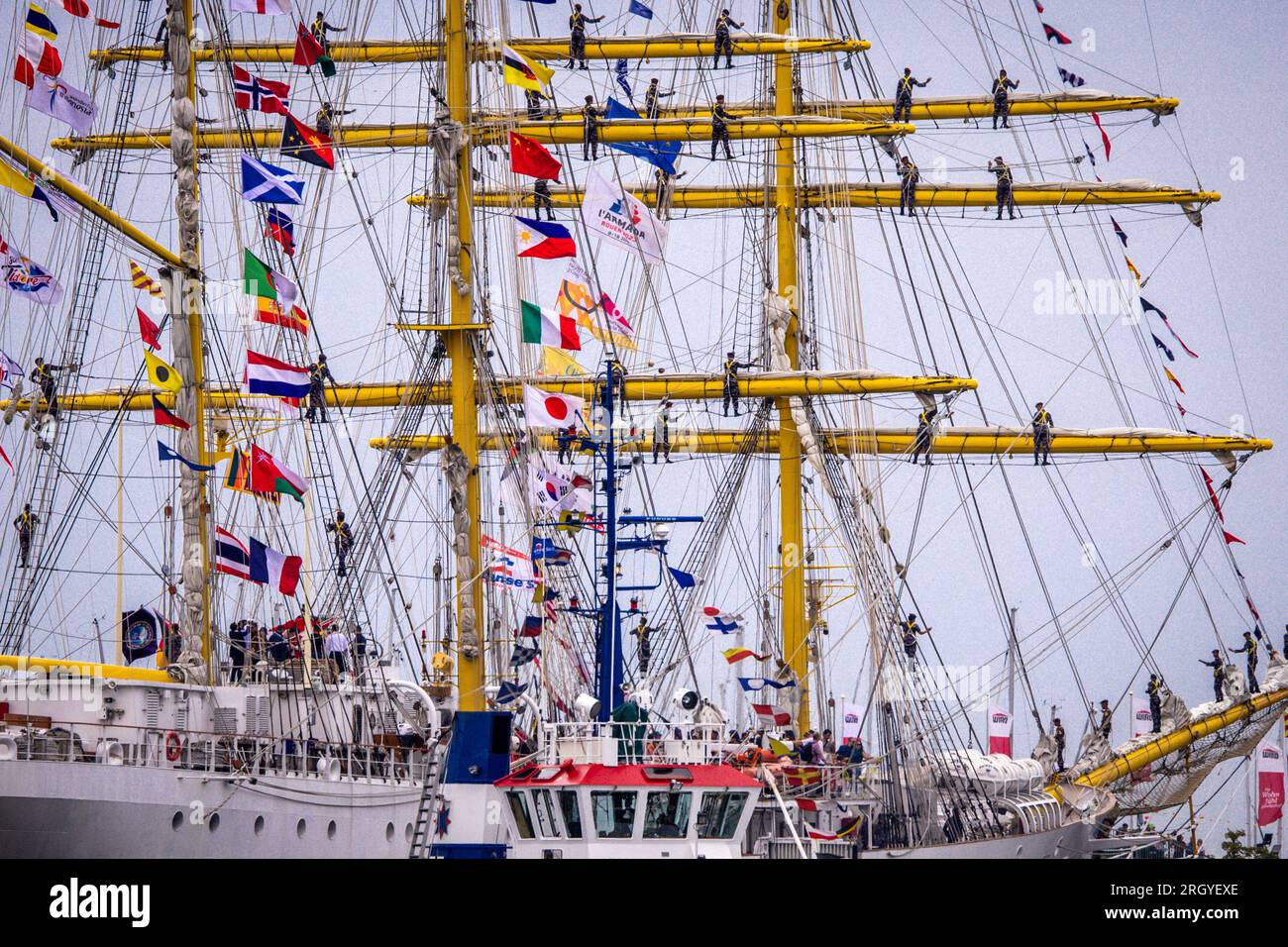 Rostock, Germany. 12th Aug, 2023. At the 32nd Hanse Sail sailors stand ...