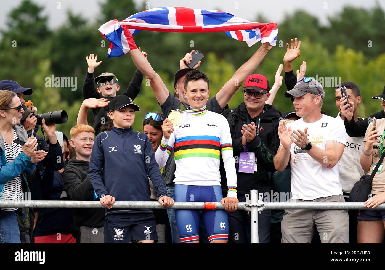 Great Britain's Thomas Pidcock celebrates with spectators and the gold ...