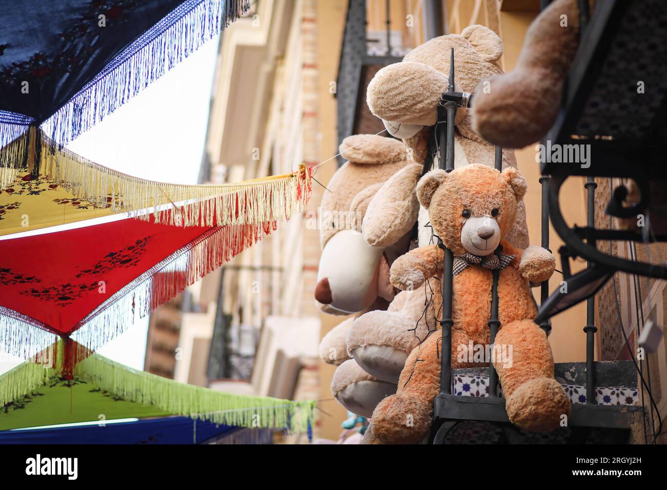 Madrid, Spain. 12th Aug, 2023. Teddy bears seen on a balcony on Calle ...