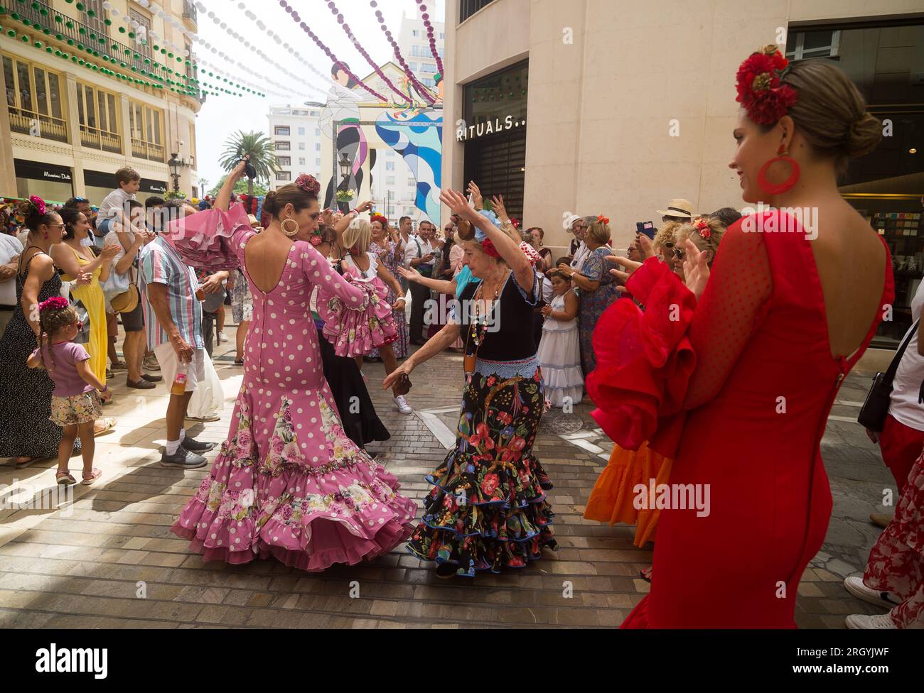Malaga, Spain. 12th Aug, 2023. Women dressed in traditional flamenco ...
