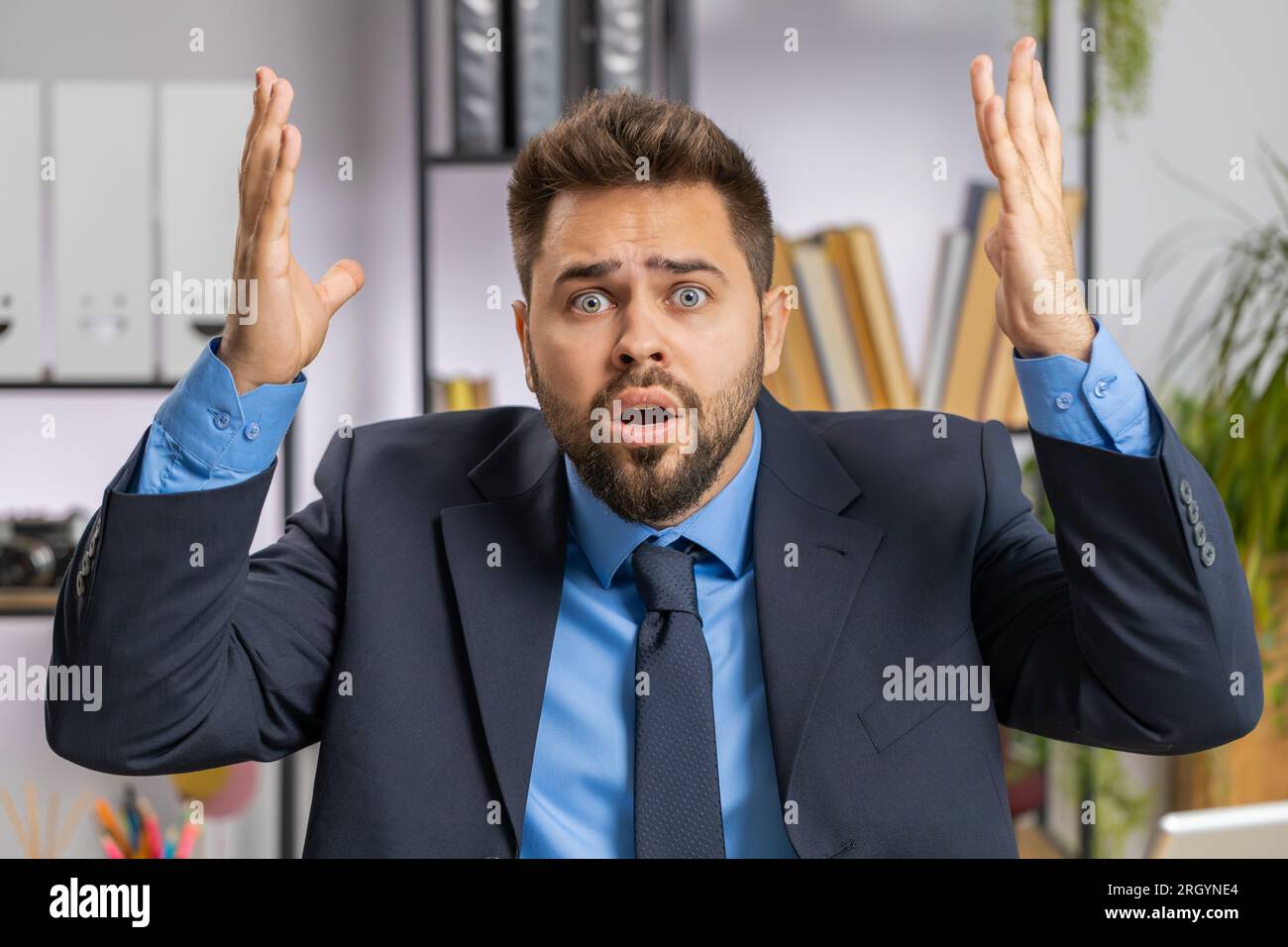Excited amazed Caucasian bearded businessman freelancer looking shocked ...