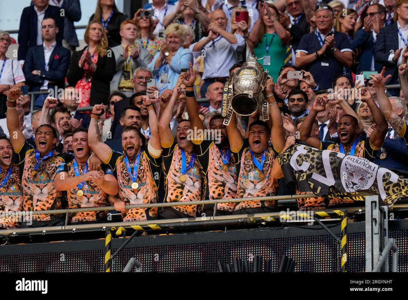 John Asiata #13 of Leigh Leopards lifts the BetFred Challenge Cup ...